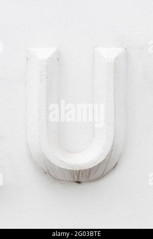 White stucco letter T on white ground Stock Photo - Alamy