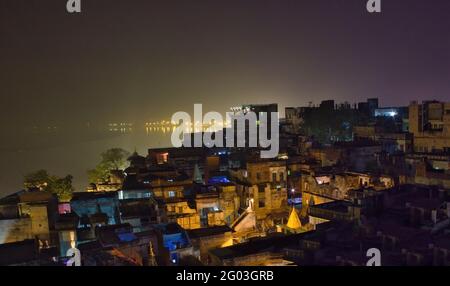 mystical night landscape with an illuminated brick tower against the ...