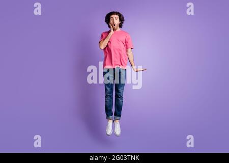 Full length photo of young impressed brunette guy ride board wear shirt ...