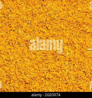 square food background - ground dried tagetes (imeretian saffron) close ...