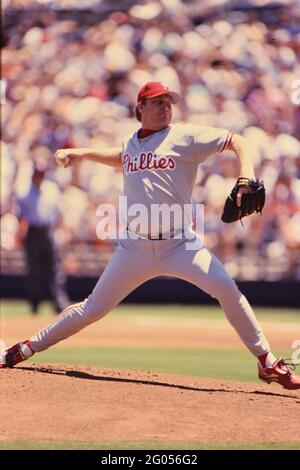 Philadelphia Phillies pitcher Curt Schilling lays down a sacrifice bunt ...