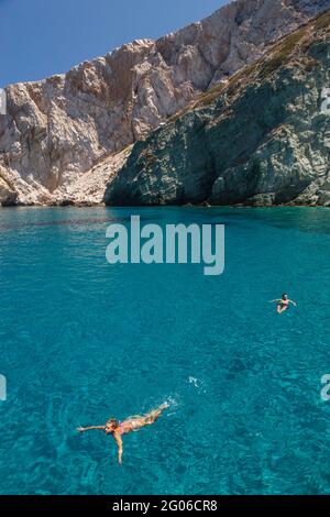 crystal clear water, cliffs on the north coast, Folegandros island ...