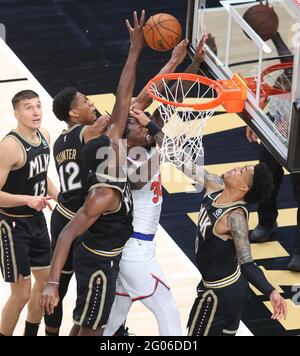 Atlanta Hawks' Clint Capela, left, in action against Philadelphia 76ers ...