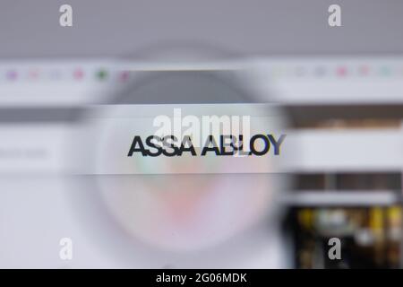 Assa Abloy company logo on a website with blurry stock market ...