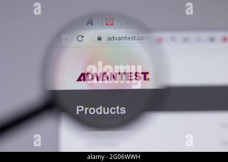 Advantest company logo on a website with blurry stock market ...