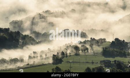 Foggy spring sunrise in Plana de Vic, seen from Sant Bartomeu del Grau ...