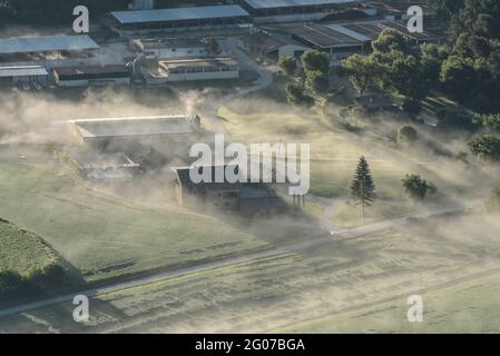 Foggy spring sunrise in Plana de Vic, seen from Sant Bartomeu del Grau ...