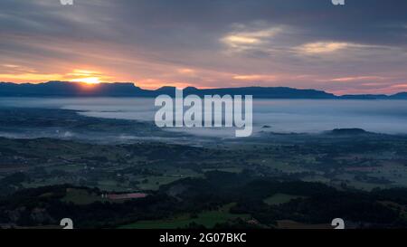 Foggy spring sunrise in Plana de Vic, seen from Sant Bartomeu del Grau ...