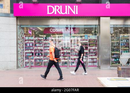 Two men wearing facemasks as a precaution against the spread of covid ...
