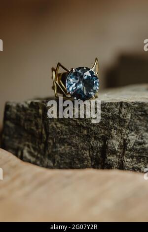 Side view of gem ring detail. A ring in a modern avant-garde style ...