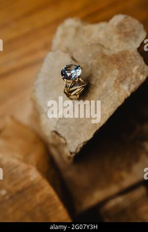 Side view of gem ring detail. A ring in a modern avant-garde style ...
