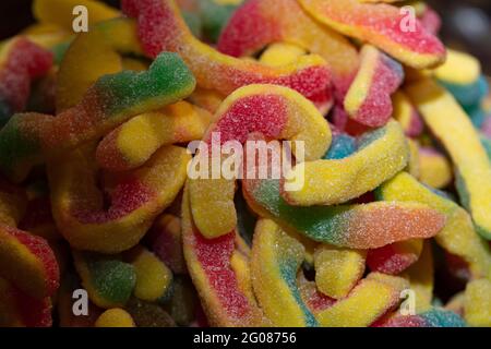 Multicolored jelly worm candies textured background Stock Photo - Alamy