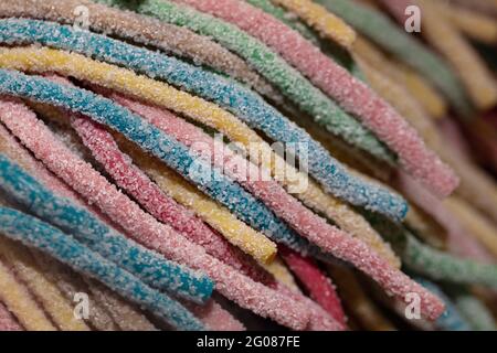 Multicolored jelly worm candies textured background Stock Photo - Alamy
