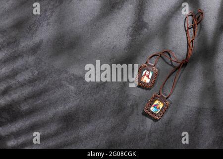 Catholic scapular, symbol of the Christian faith Stock Photo - Alamy