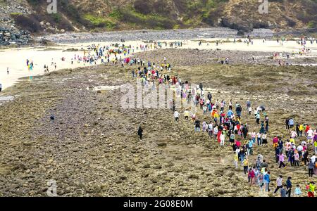 Pilgrims walk across island to temple to worship goddess for peace ...