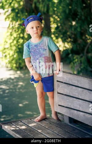 Beautiful toddler boy standing at kindergarten with lots of toys Stock ...