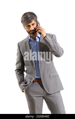 business man talking on a smartphone sitting in the living room Stock ...