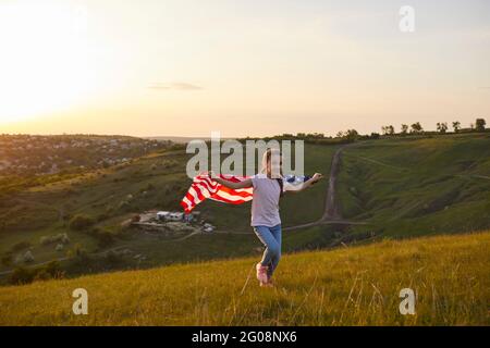 Happy family running through field with kite Stock Photo - Alamy