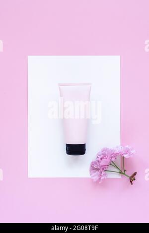 Blank white cosmetics tube and spring flowering tree branch with white ...