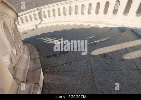 Ancient stone twisted staircase leading down. Large staircase with ...