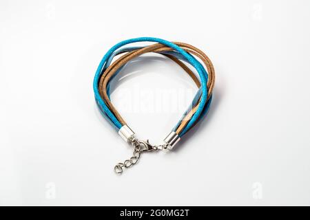 Macro of handmade bracelet made with colorful leather straps, clover ...