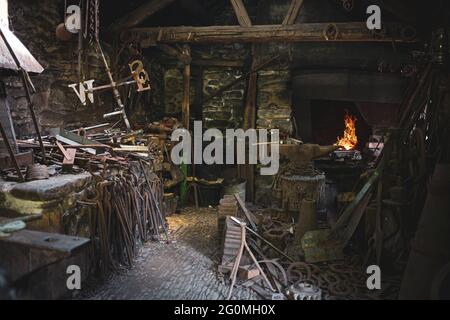 The interior of the old blacksmiths workshop Stock Photo - Alamy