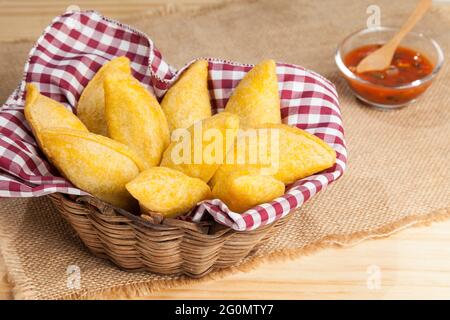 Tasty empanadas - Colombian cuisine; photo on wooden background Stock ...