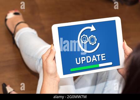 Tablet screen displaying an update concept Stock Photo - Alamy
