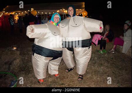 People dressed in inflatable costumes protest outside the U.S ...