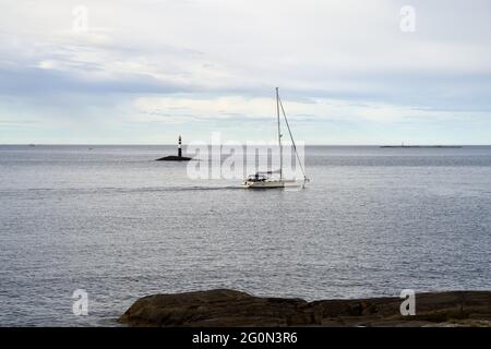 VEVANG, NORWAY - Jul 28, 2020: A woman is walking close to the ...