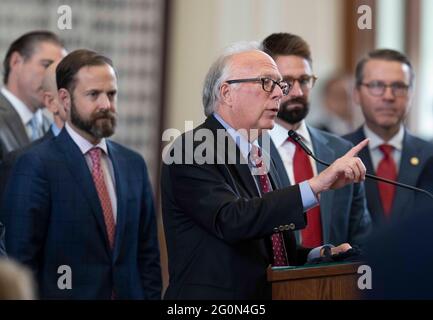 Texas Rep. Todd Hunter, R-Corpus Christi, is surrounded by fellow ...