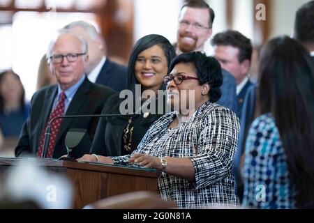 Texas state Rep. Toni Rose laughs as she shares her permission slip to ...