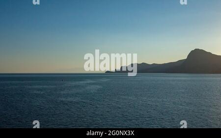 Rocks, slight sea waves at sunset on a warm summer evening Stock Photo ...