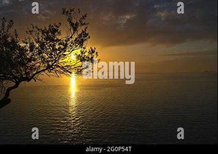 View from the coast of Vlora on the island of Sazan at sunset through ...