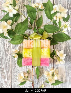 Homemade natural soap bar and dry flower on black background Stock ...