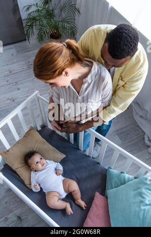 overhead view of african american father and son using digital tablet ...