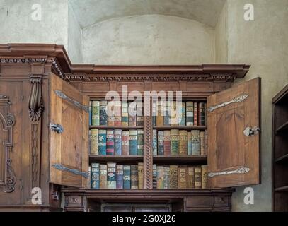 Medieval bookshelf with old books in the Old Royal Palace - Prague ...