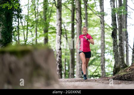 Girl running on trail, traveling through beautiful and beautiful ...