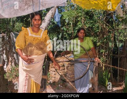 ALLEPPEY, KERALA, INDIA - Women spinning coir, coconut fiber, into ...