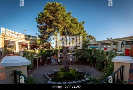 Panoramic view of elegant outdoor Spanish architecture shopping mall ...