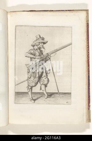 Soldier on guard the pan of his musket with two fingers covered against ...