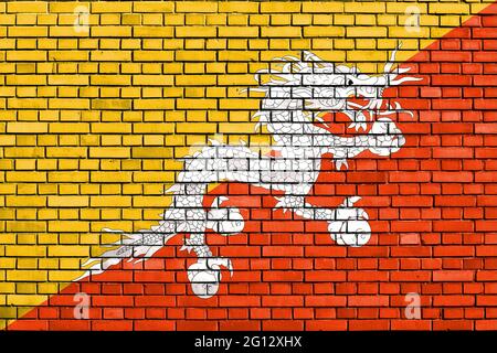 Bhutan national flag painted on textured wall mural background Stock ...