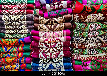 Colorful textiles with traditional pattern at local market. Otavalo ...