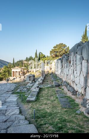 The polygonal wall at Delphi,Greece, with the temple of Apollo in the ...