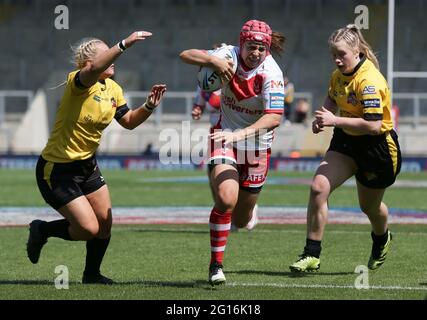 St Helens' Emily Rudge (centre) celebrates with the trophy and team ...