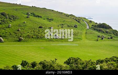 Eastbourne, UK. 05th June, 2021. A large chalk hairpin sculpture can ...