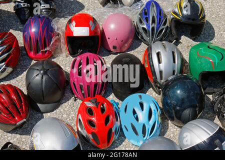 Colorful bike protective head helmets for safe cycling in a city Stock ...