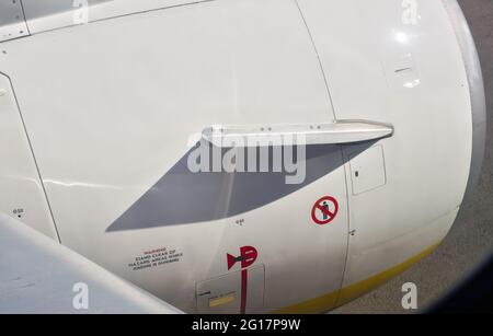 Warning sign on an aircraft engine about the hazardous areas around a ...