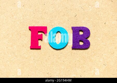 Alphabet letter in word FOB (abbreviation of free on board) on wood ...