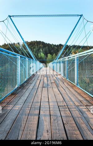 Wooden bridge over deep river. Summer time Stock Photo - Alamy